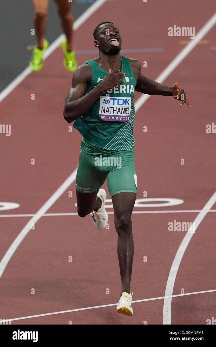 Nigeria's Ezekiel Nathaniel crosses the finish line in the men's 400 ...