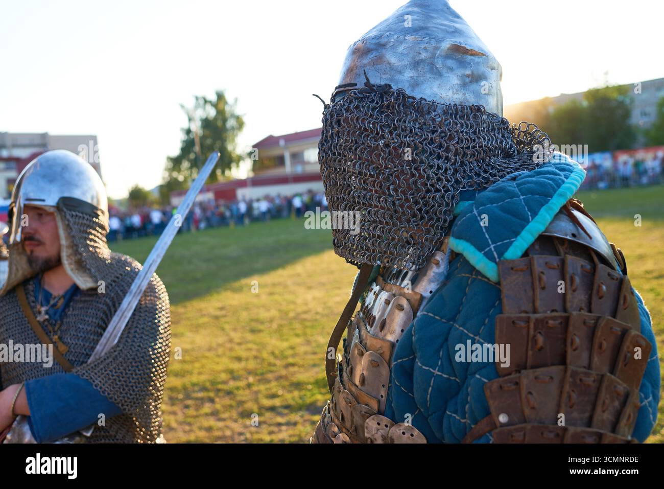 Two Caucasian men wearing medieval armor participating in historical ...