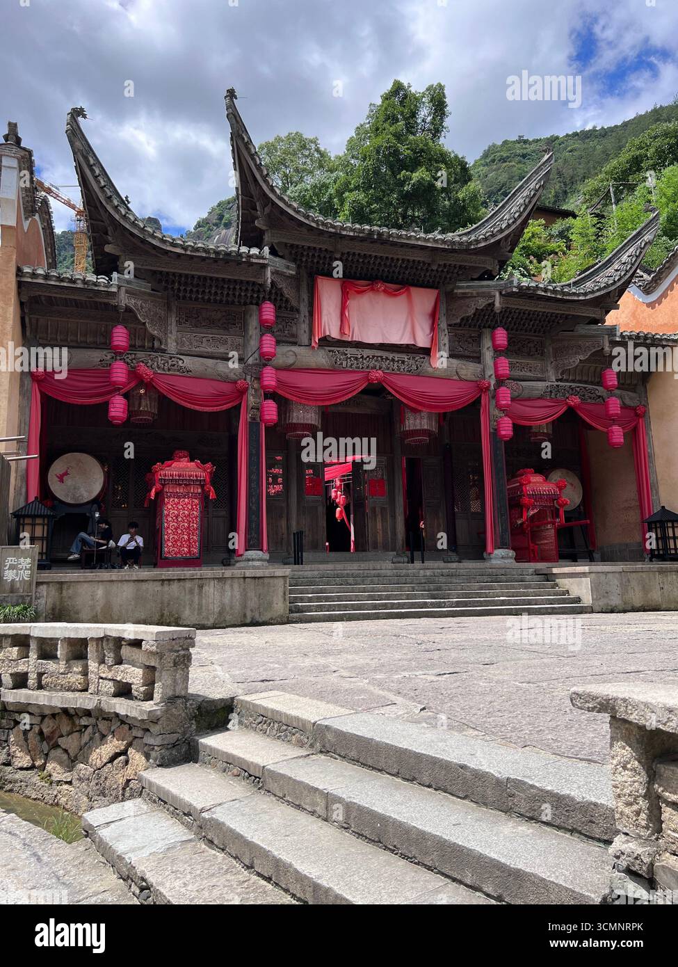 Ancient Chinese theater building decorated with red lanterns in ...