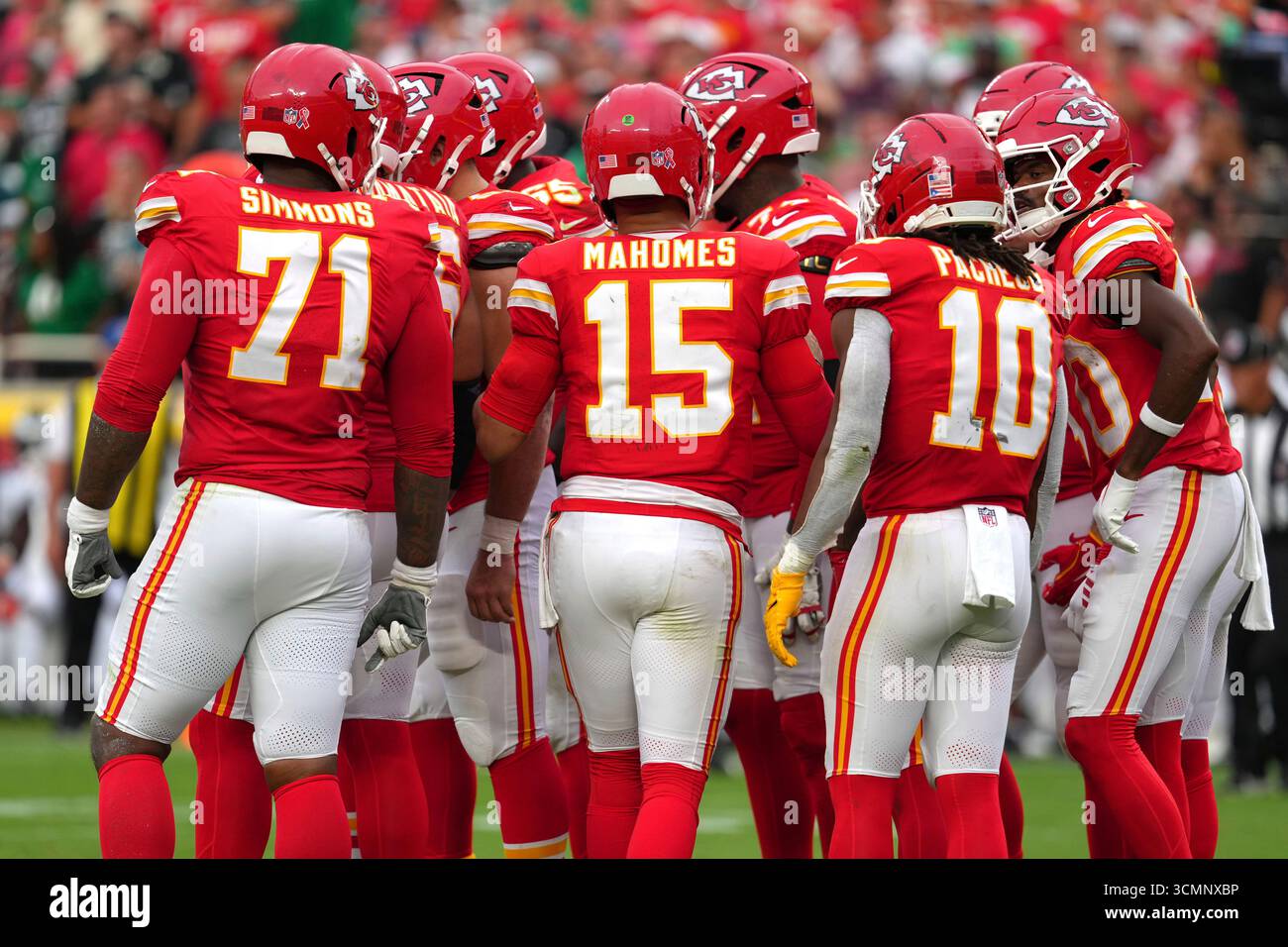 Kansas City Chiefs quarterback Patrick Mahomes (15) huddles his team during an NFL football game ...