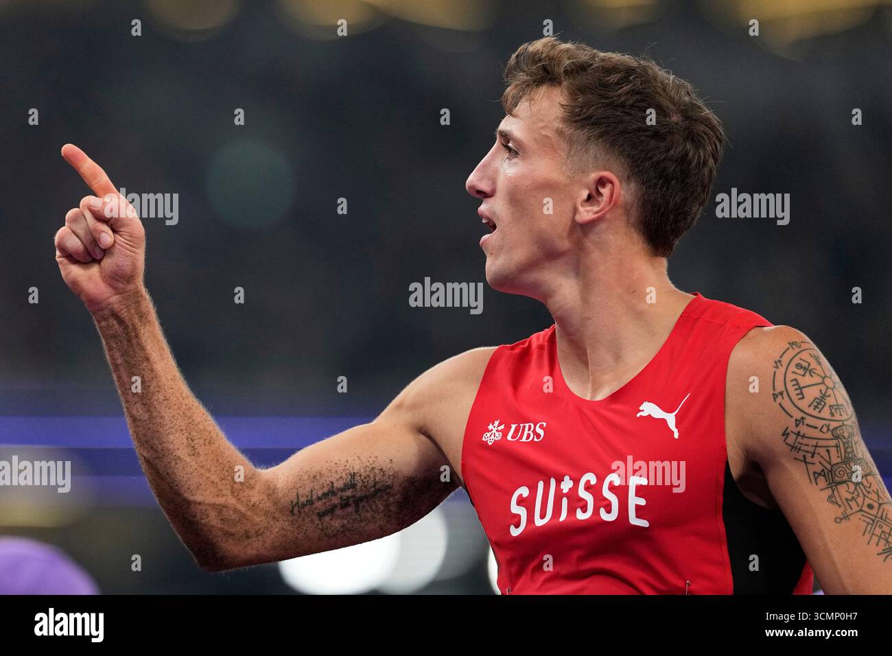 Switzerland's Simon Ehammer reacts in the men's long jump final at the ...