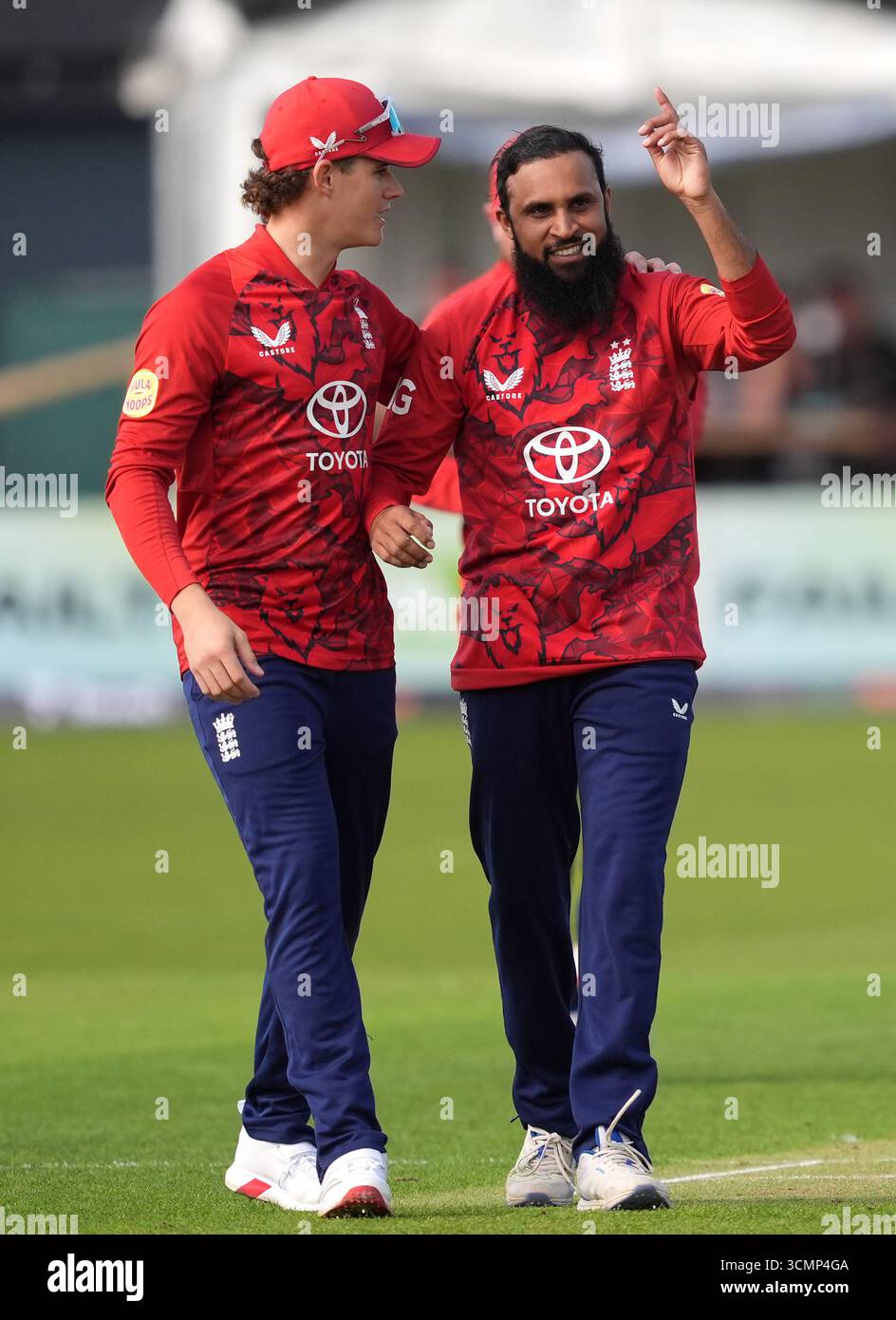 England's Jacob Bethell (left) and Adil Rashid celebrate the wicket of ...