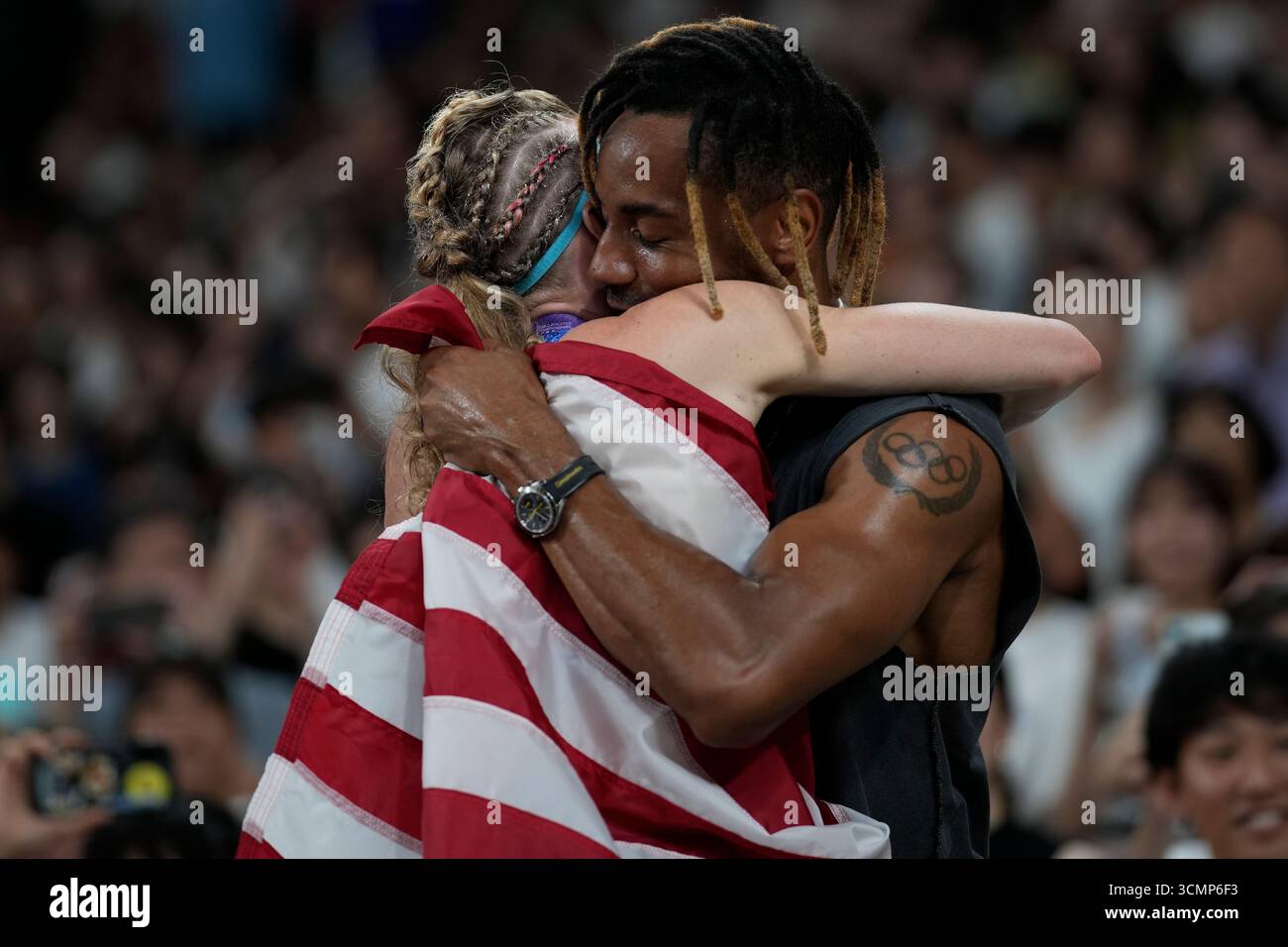 United States' Sandi Morris silver medalist, left, hugs her husband ...
