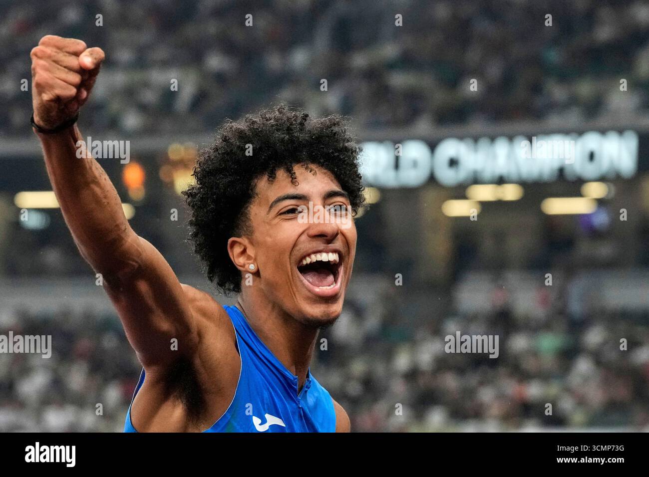 Italy's Mattia Furlani reacts after taking the gold medal in the men's ...