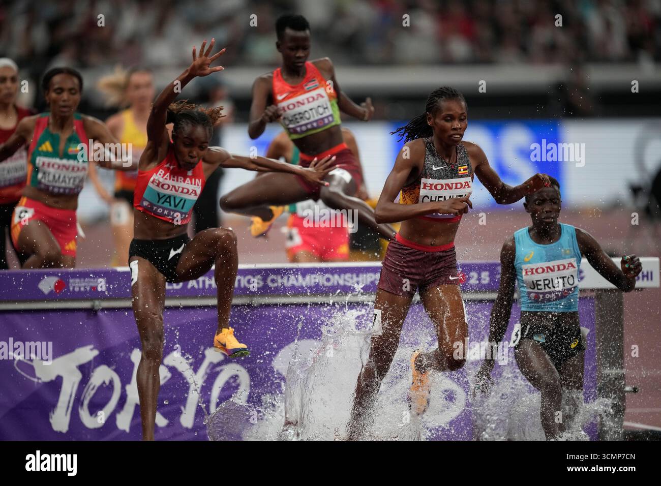 Athletes compete in the women's 3000 meters steeplechase final at the ...
