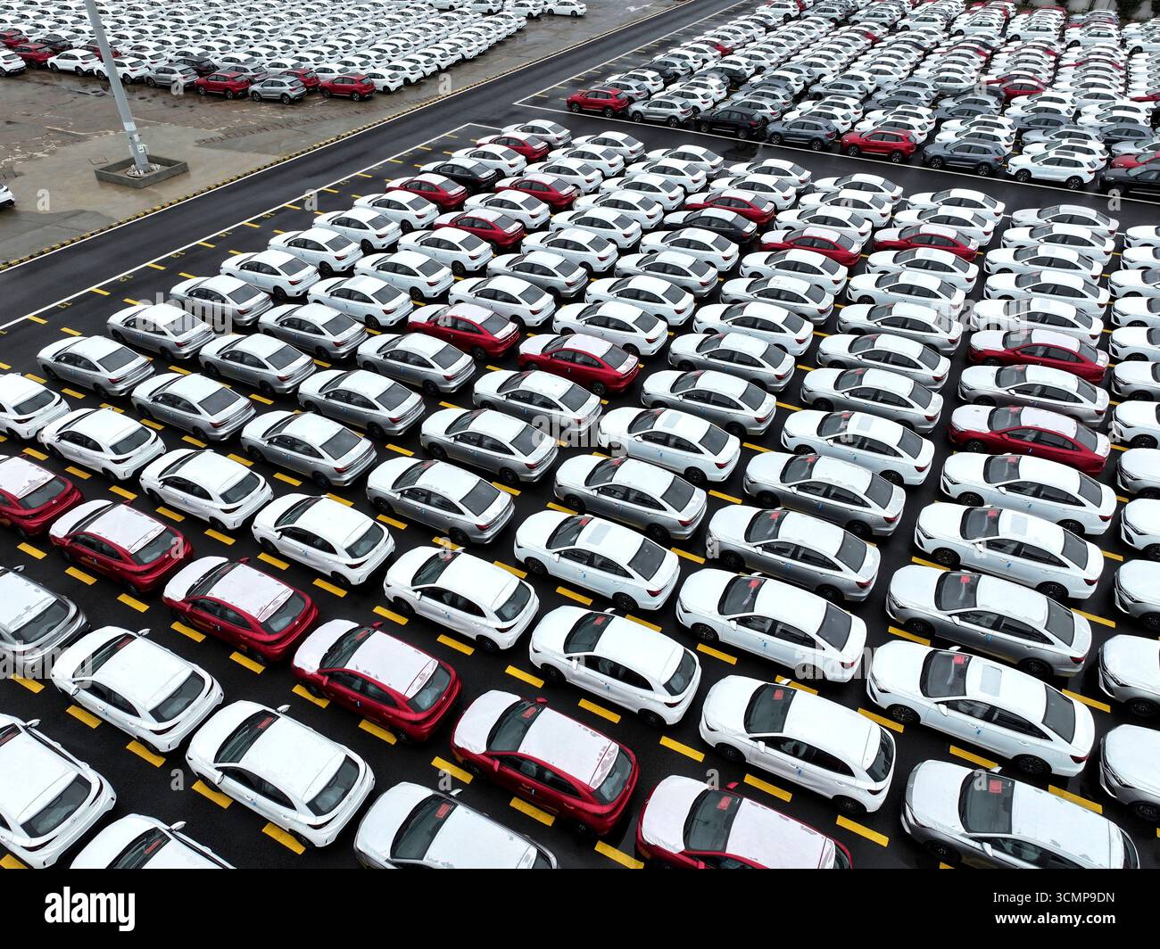 Aerial view of new cars waiting for shipment to overseas markets in a ...