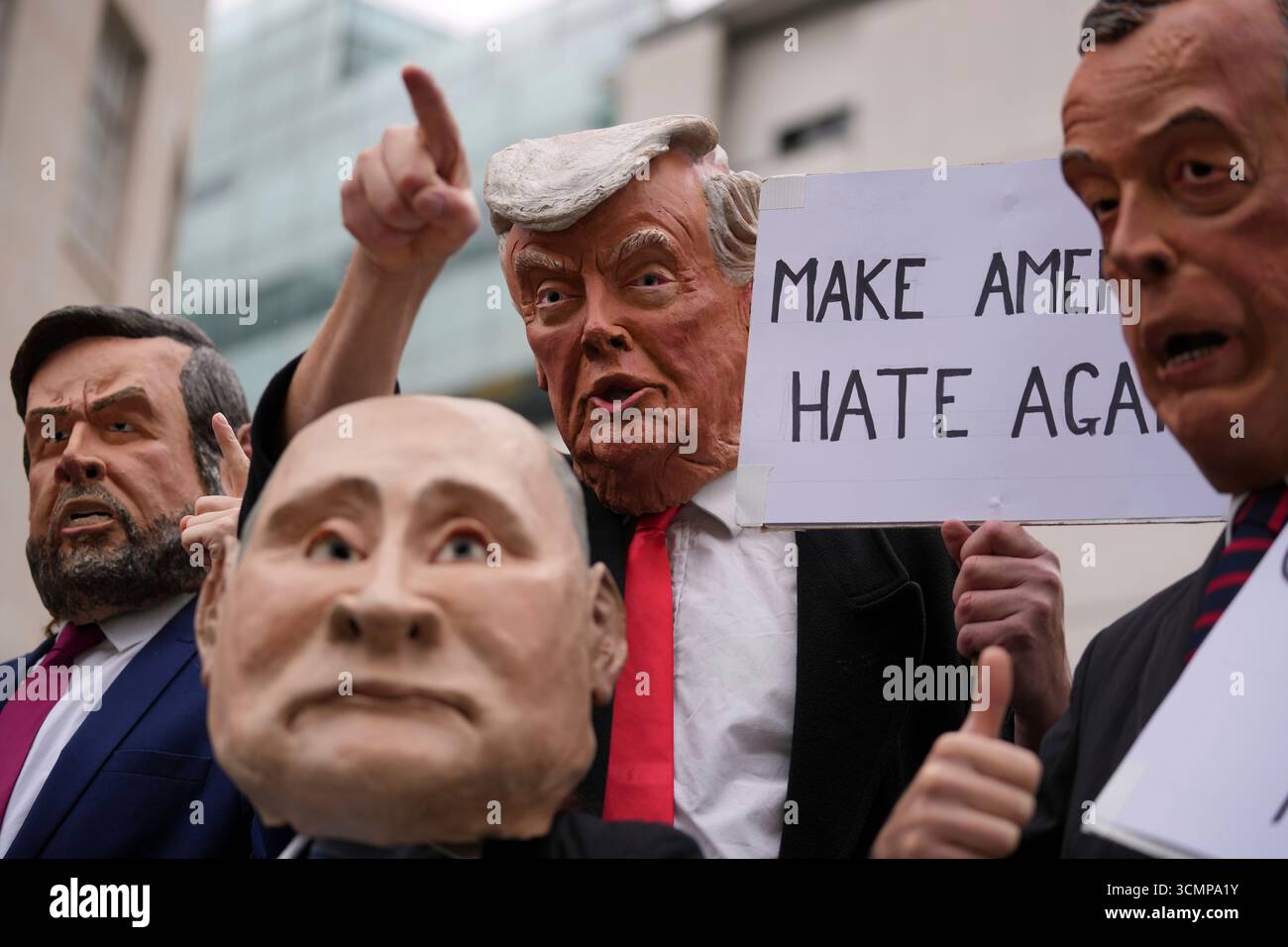 Protesters wear masks of politicians during a demonstration of the Stop ...