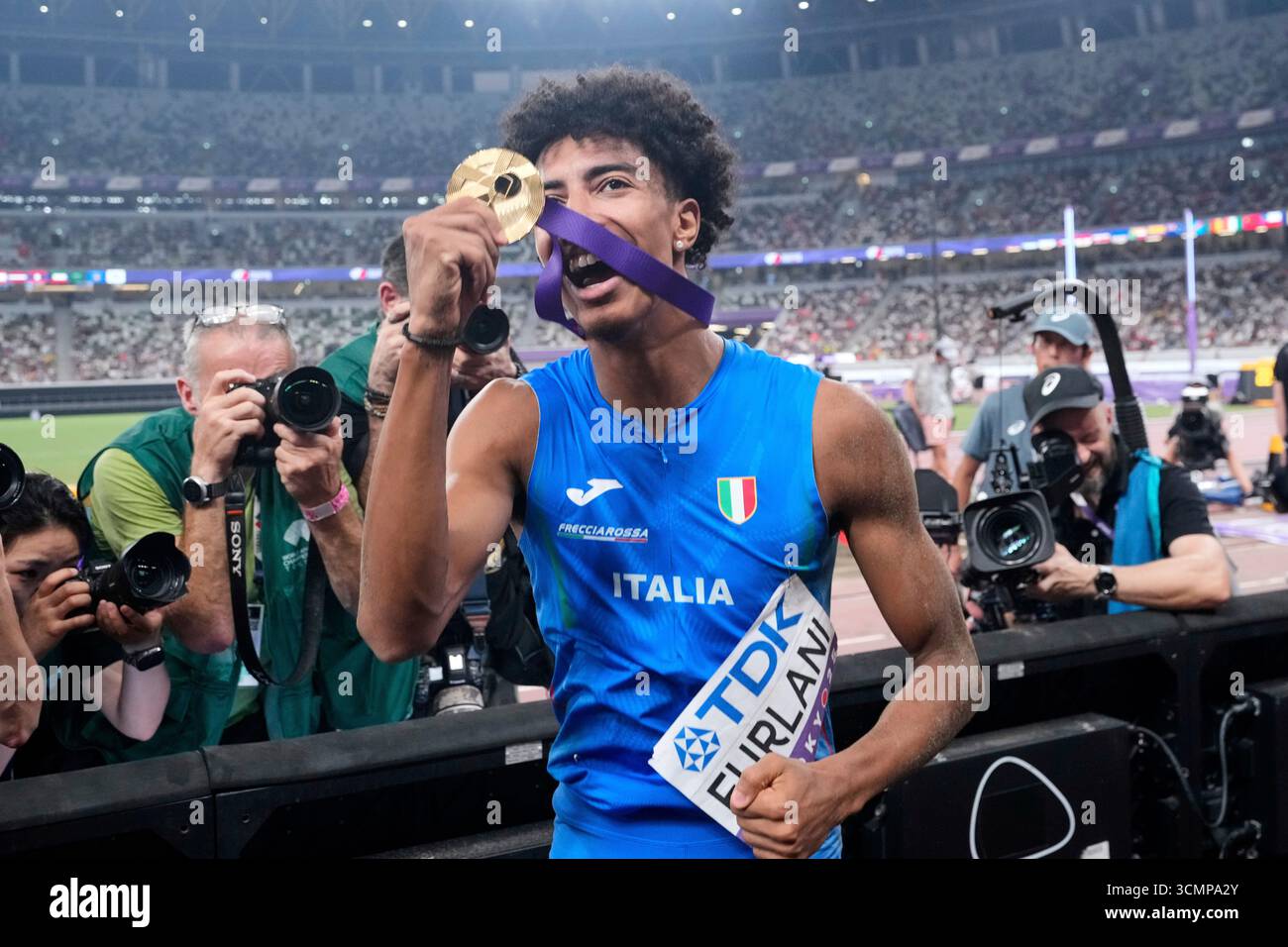 Italy's Mattia Furlani reacts after taking the gold medal in the men's ...