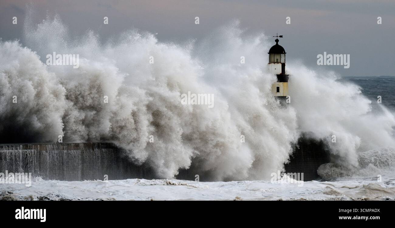 Seaham Lighthouse takes a battering as stormy seas lead to huge waves ...