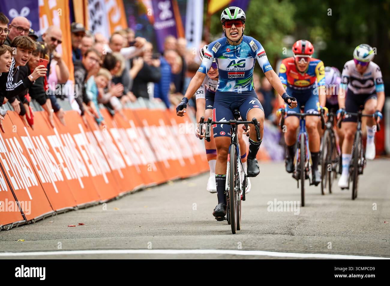 Belgian Shari Bossuyt celebrates as she crosses the finish line to win ...