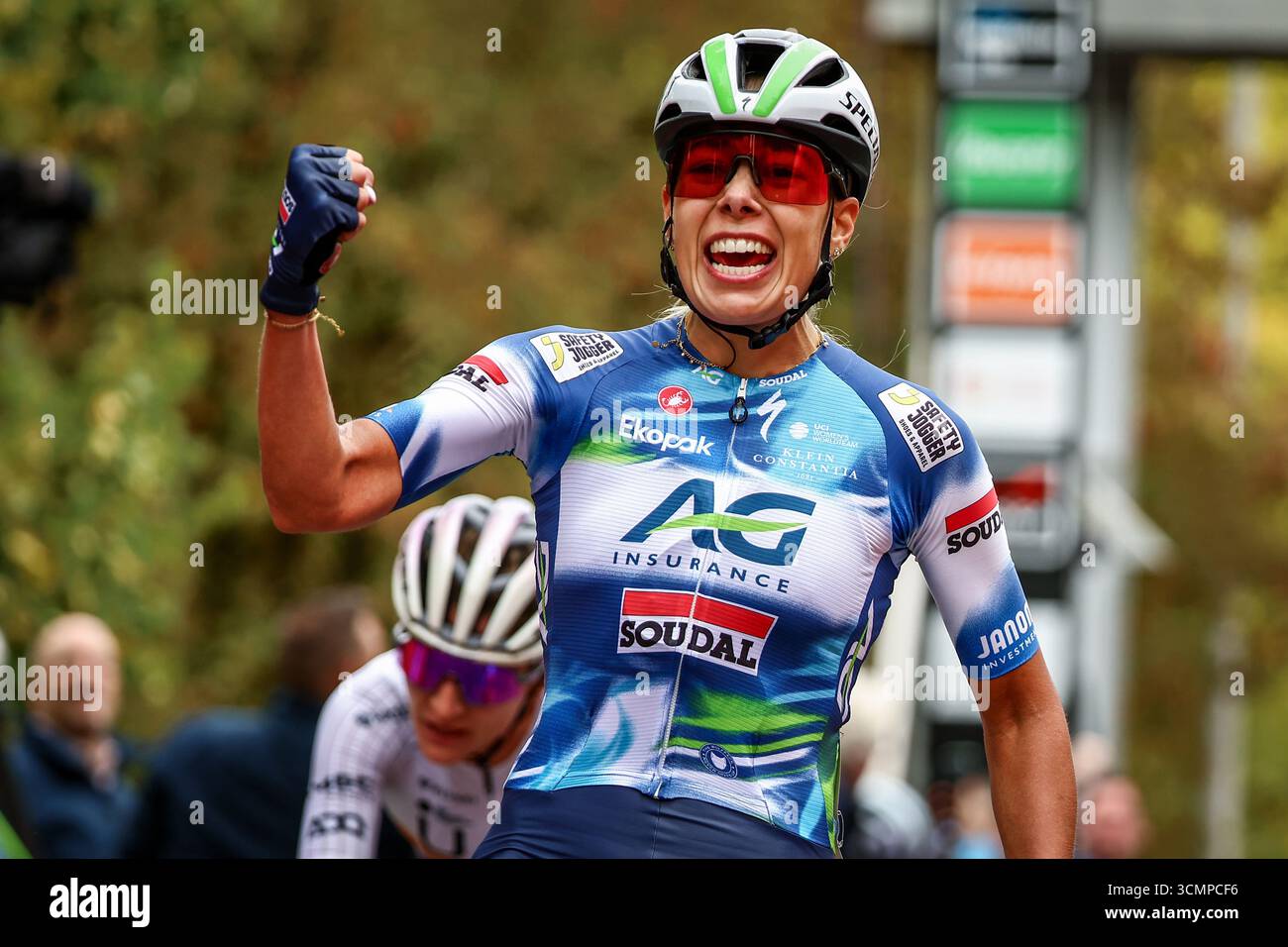 Belgian Shari Bossuyt celebrates as she crosses the finish line to win ...