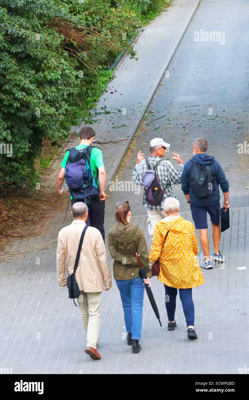 People walking along a pathway in an urban setting Stock Photo - Alamy