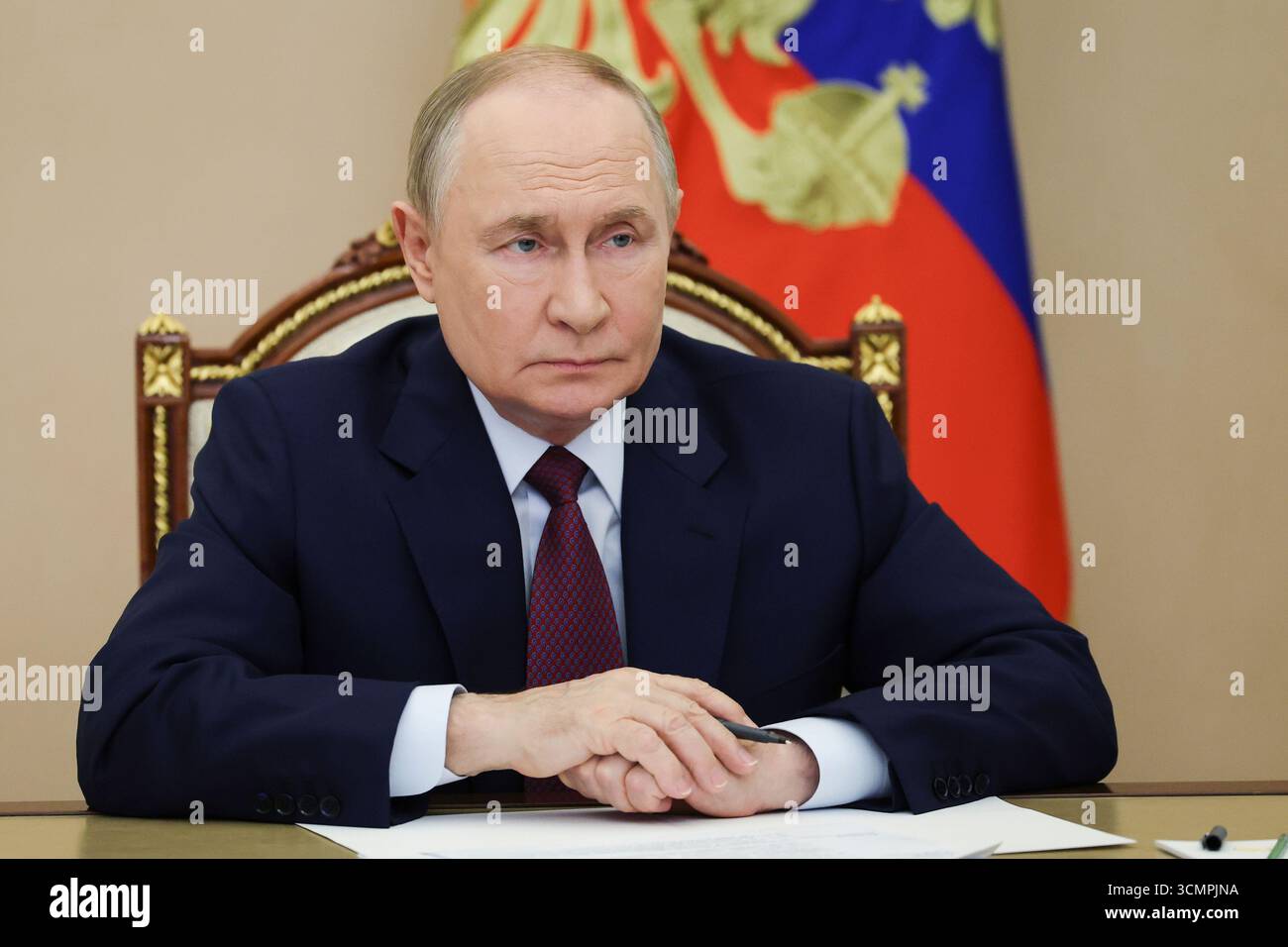 Russian President Vladimir Putin leads a cabinet meeting via ...