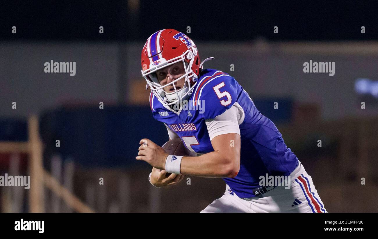 Louisiana Tech quarterback Blake Baker (5) runs during an NCAA football ...