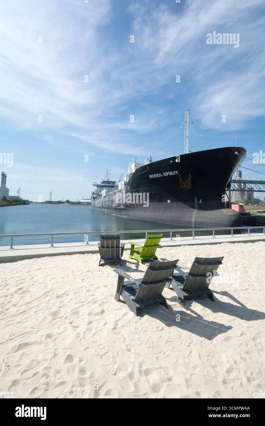 A large Great Lakes freighter moored in front of Leslie Lookout Park, a ...