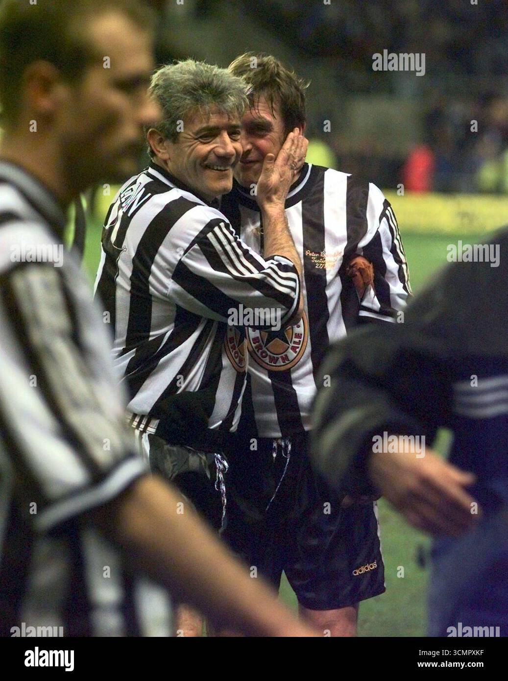 Kevin Keegan and Kenny Dalglish embrace during Peter Beardsley's ...
