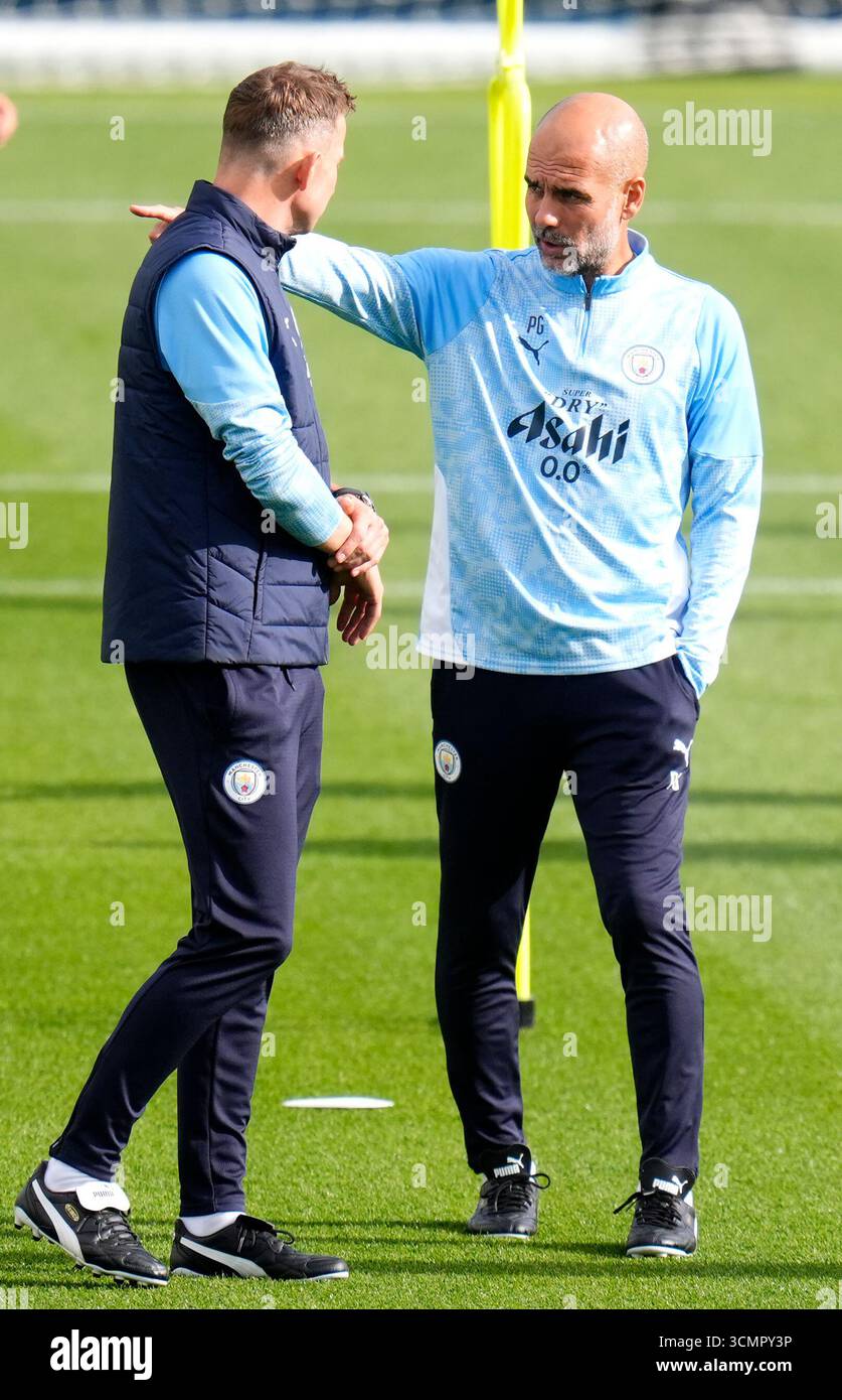 Manchester City manager Pep Guardiola (right) and assistant manager ...