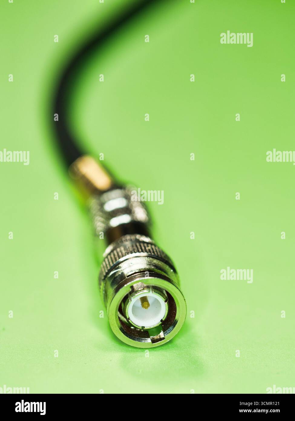 BNC connector at the end of a black cable - A detailed close-up of a ...
