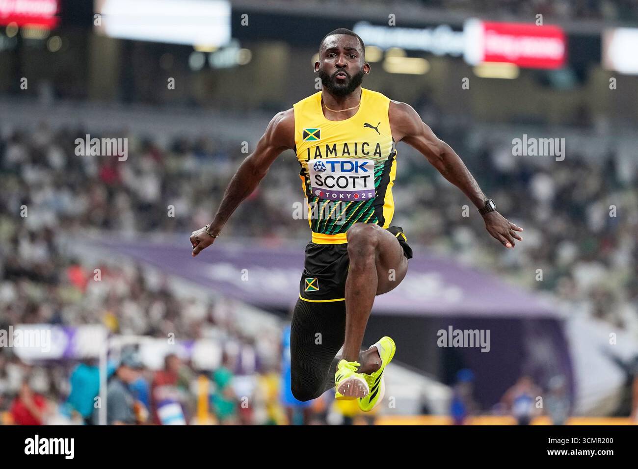 Jamaica's Jordan Scott makes an attempt in the men's triple jump ...