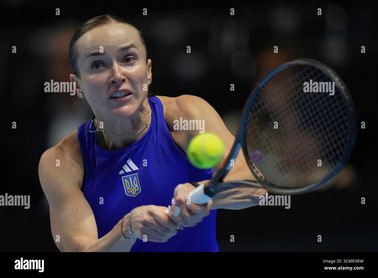 Elina Svitolina, of Ukraine returns a backhand shot to Paula Badosa ...