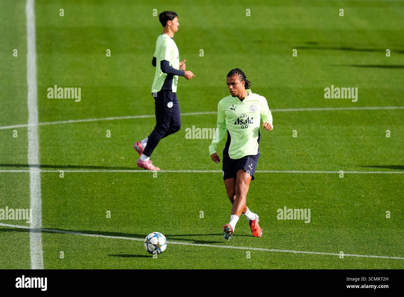Manchester City's Nathan Ake (right) and team-mate during a training ...