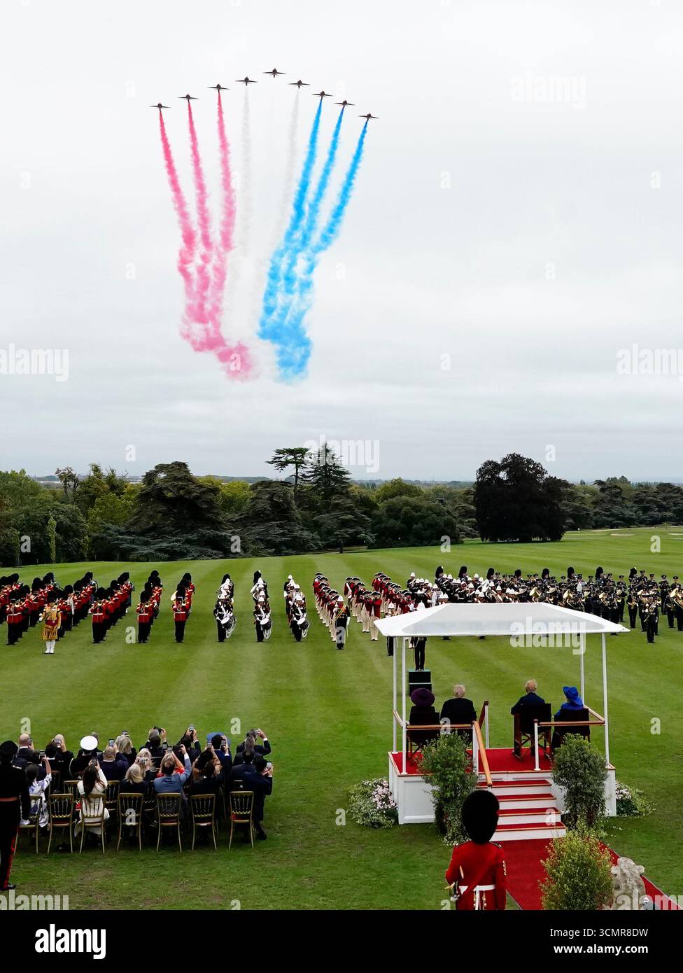 A flypast by the RAF Red Arrows takes place during a Beating Retreat ...