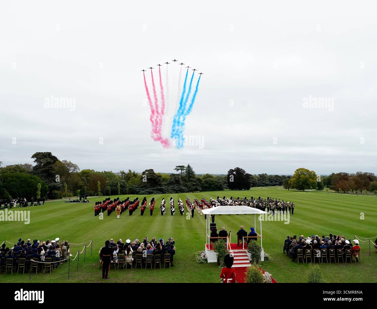 A flypast by the RAF Red Arrows takes place during a Beating Retreat ...