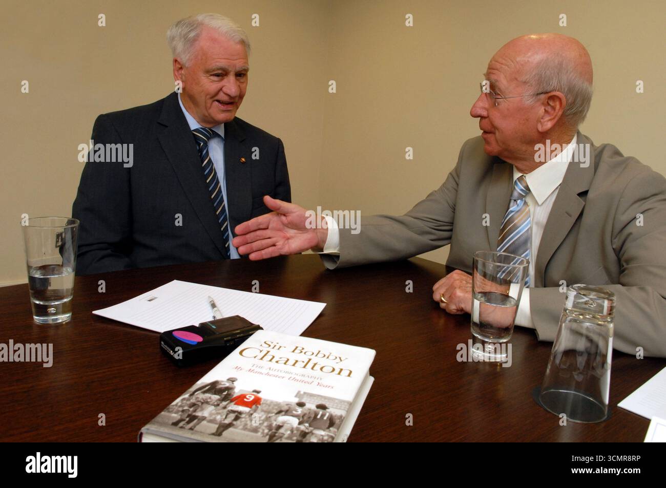 Sir Bobby Charlton meets former England manager Sir Bobby Robson while ...