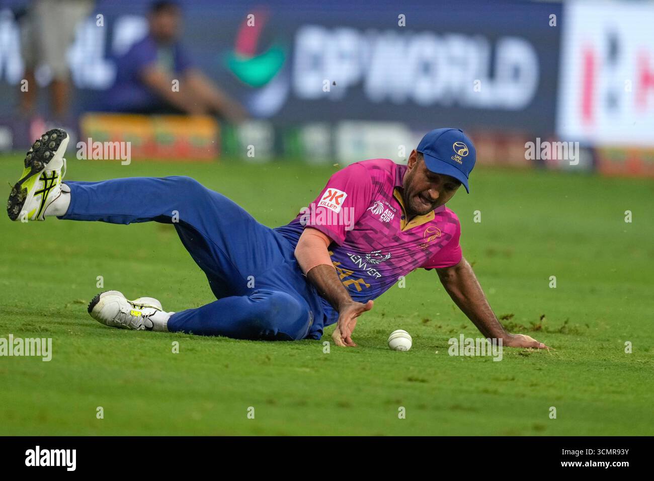 United Arab Emirates's Muhammad Zohaib fields a ball during the Asia ...