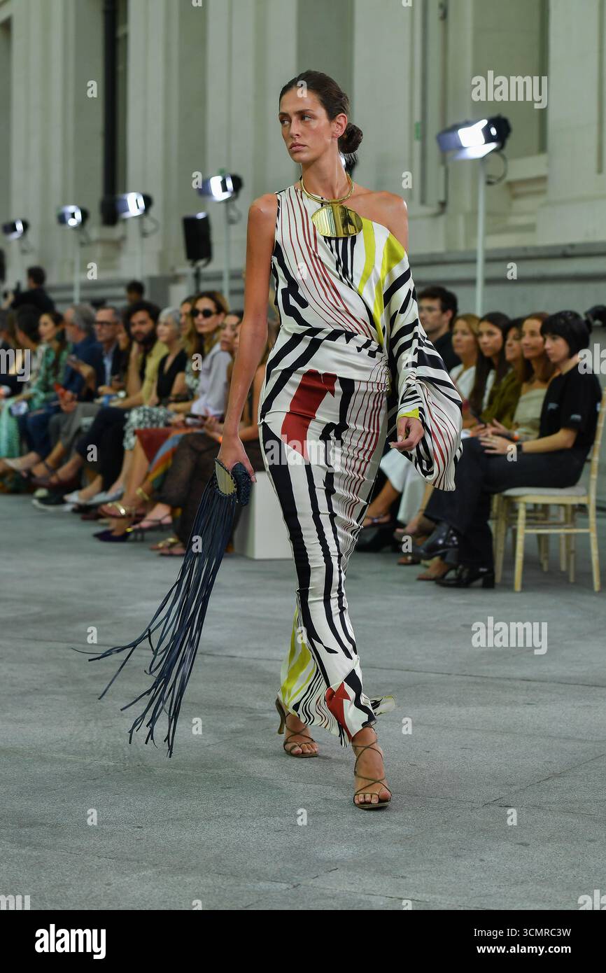 A model walks the runway wearing a design by Silvia Tcherassi during Mercedes-Benz Fashion Week ...