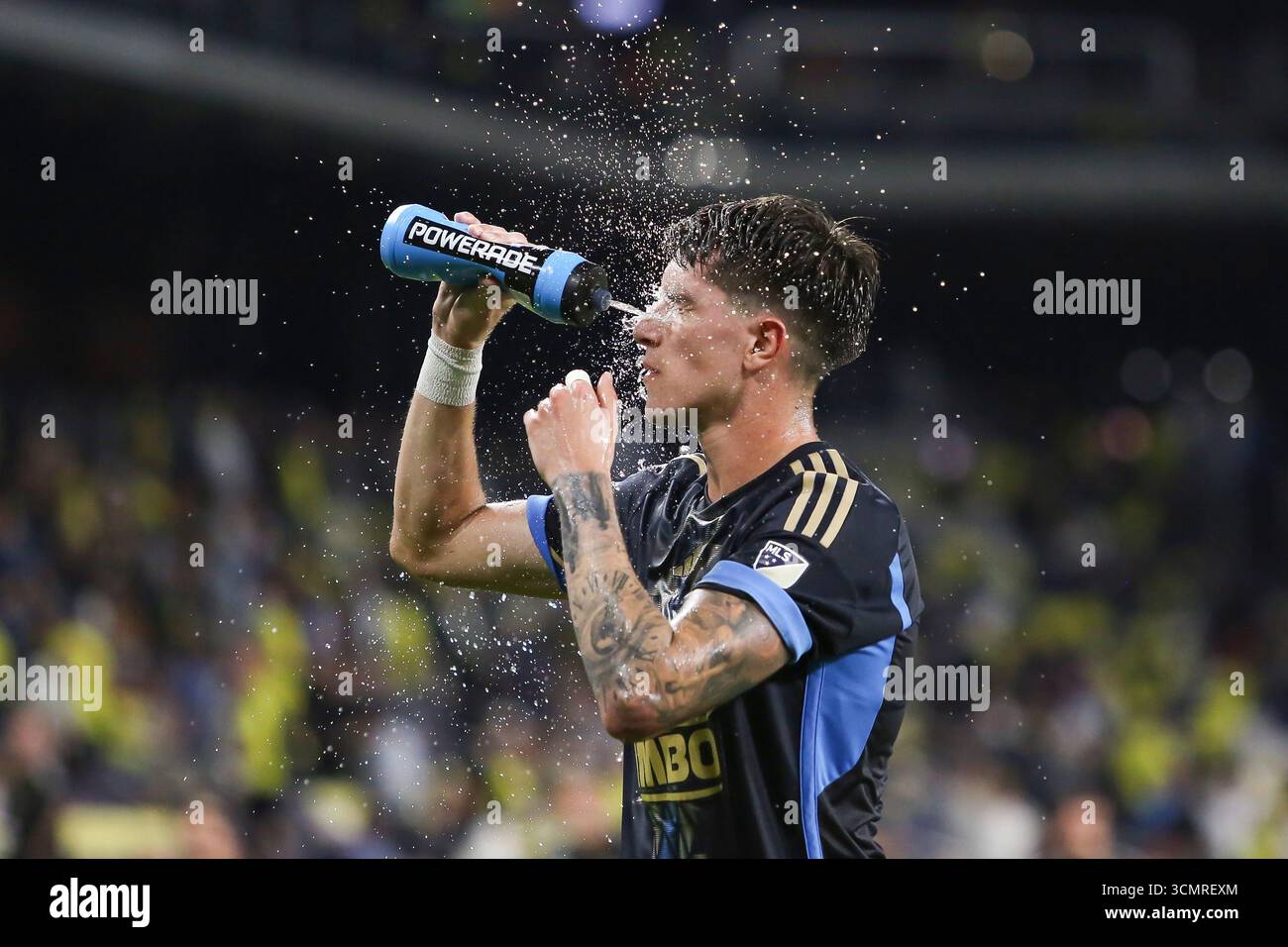 Philadelphia Union midfielder Jovan Lukic (4) douses himself with water ...