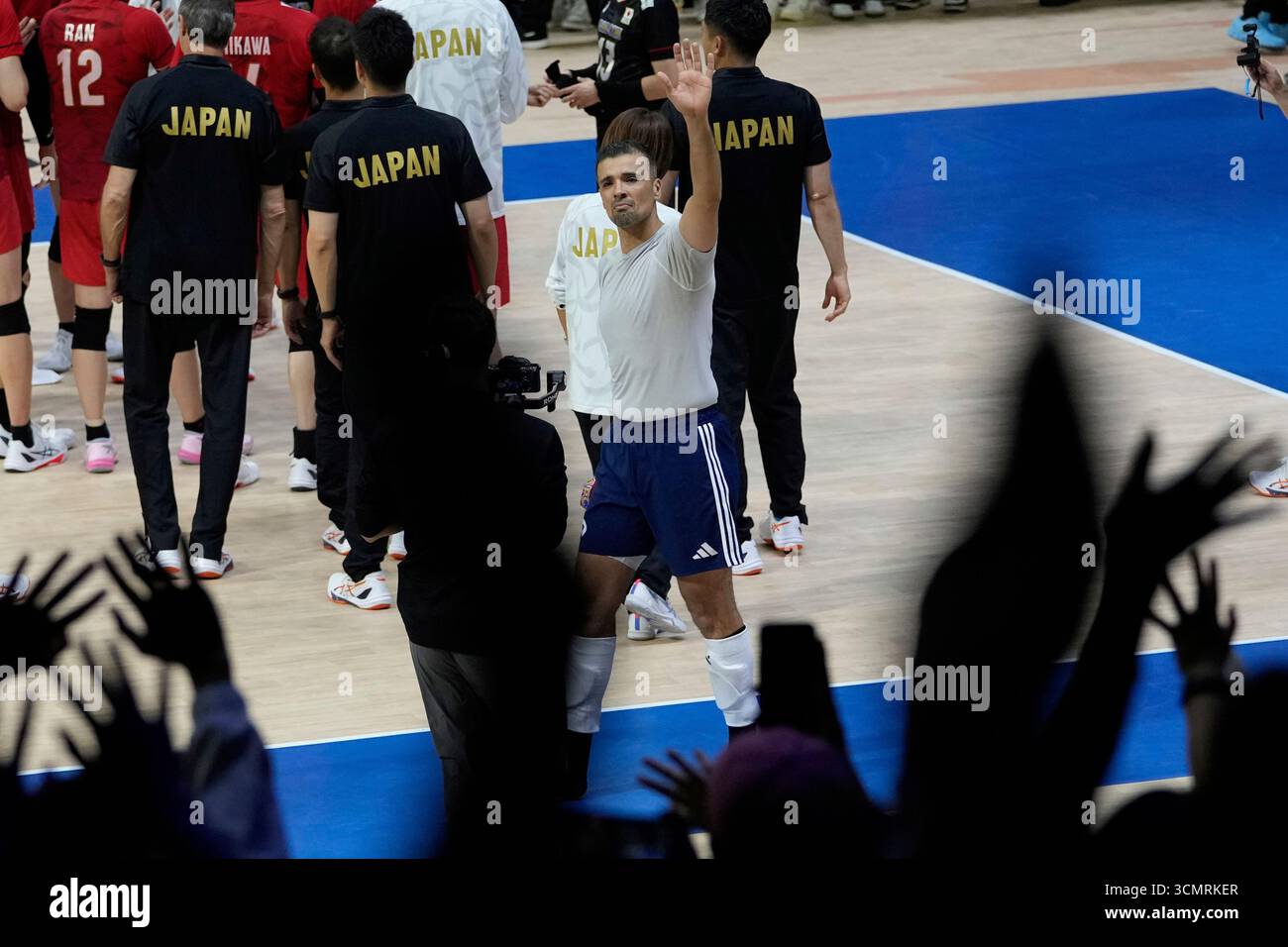 Foad Elmaarug of Libya waves to the crowd as he retires after their ...