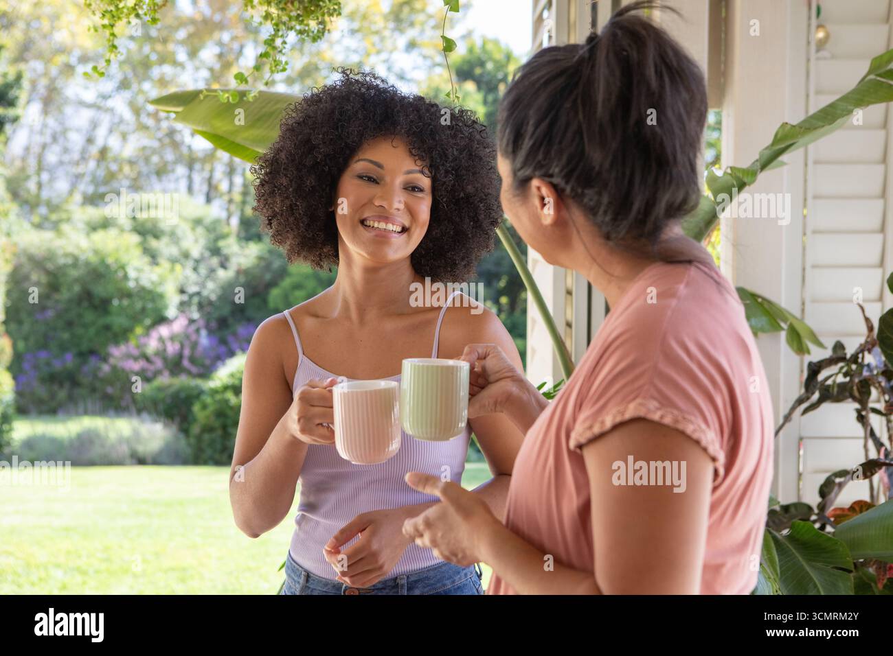 Clinking diverse female friends hi-res stock photography and images - Alamy