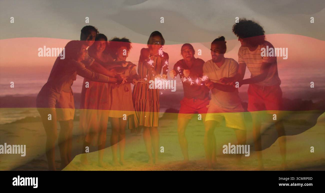 Eight friends leaning on sandy beach at sunset over ocean horizon, with ...