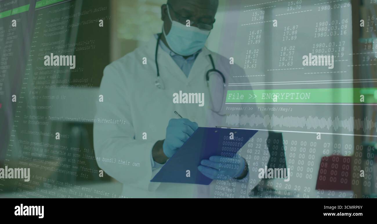 Senior African American doctor noting data in hallway, with stethoscope ...
