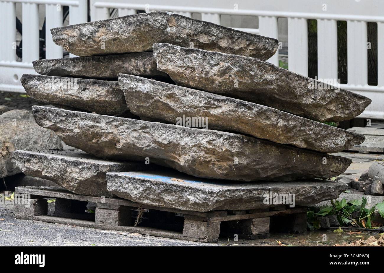 16 September 2025, Berlin: Granite paving slabs known as pork bellies ...