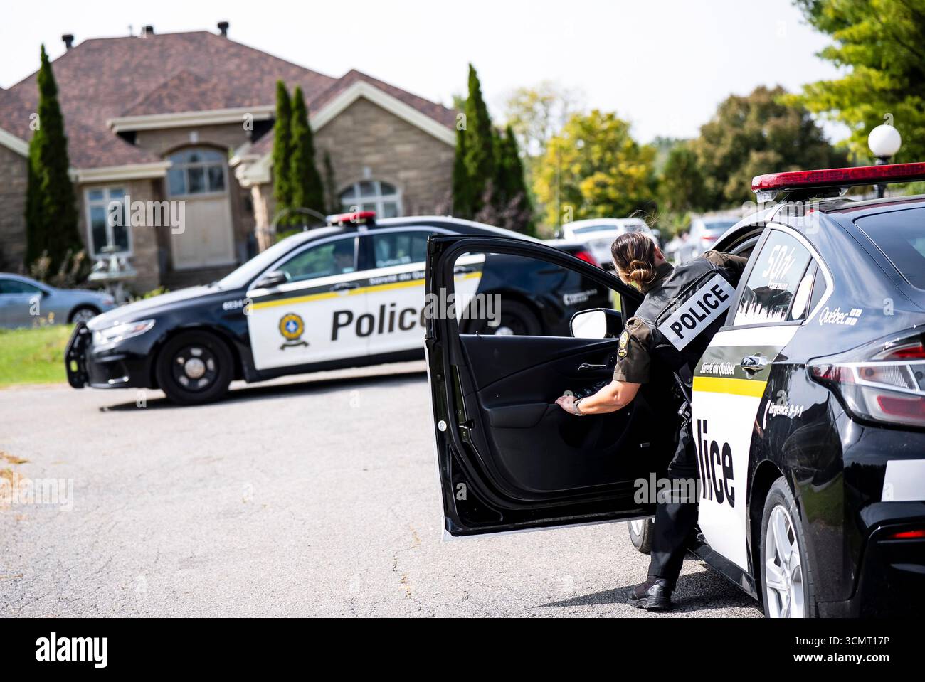 Surete du Quebec spokesperson Laurie Avoine enters her vehicle during ...