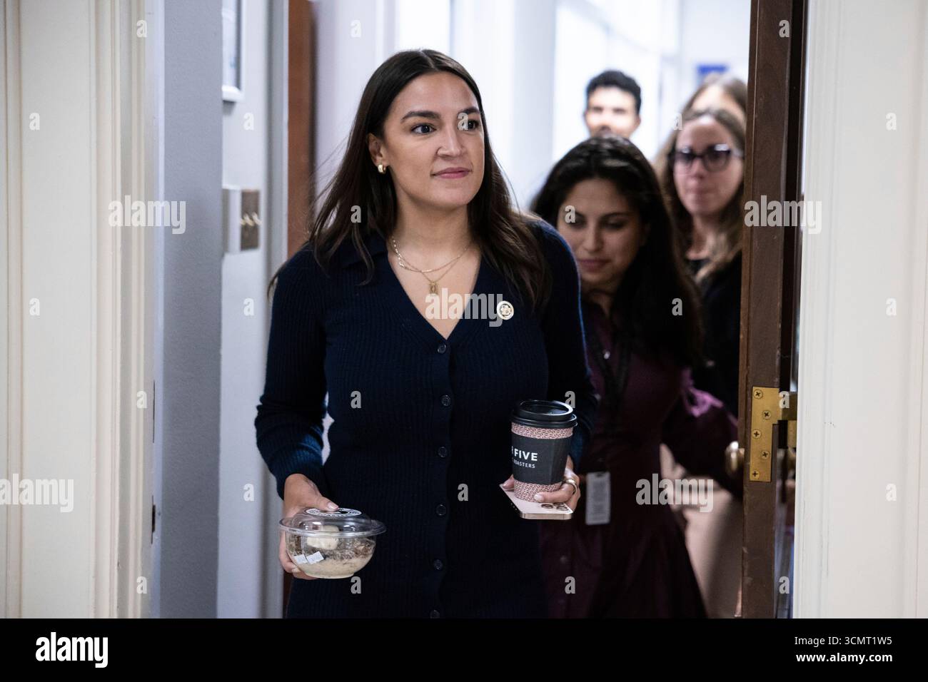 Rep. Alexandria Ocasio-Cortez (D-N.Y.) emerges from a House Energy and ...