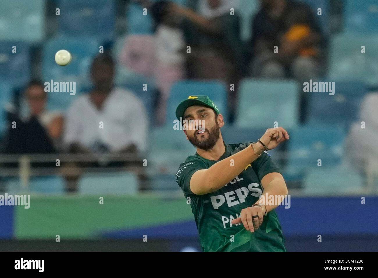 Pakistan's captain Salman Agha fields a ball during the Asia Cup ...