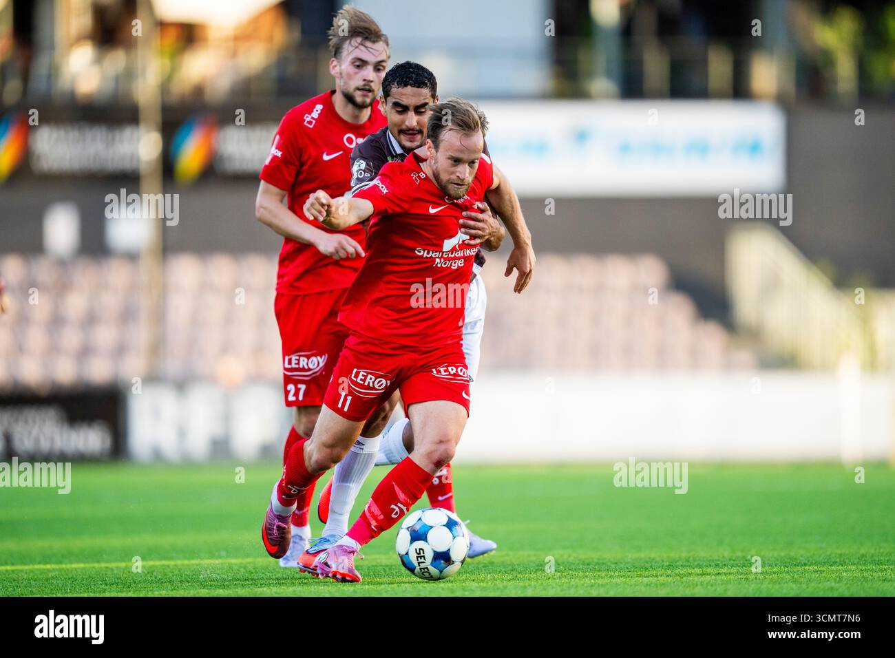 Mjøndalen 20250917. Brann's Bård Finne and Mjøndalen's Karim Bata ...