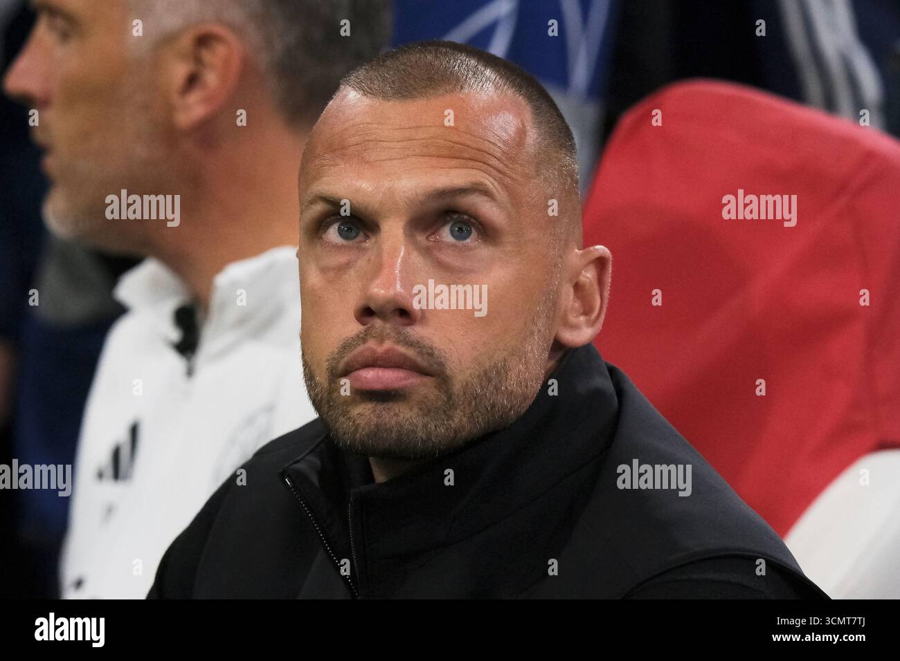 Ajax's head coach John Heitinga waits for the start of a Champions ...