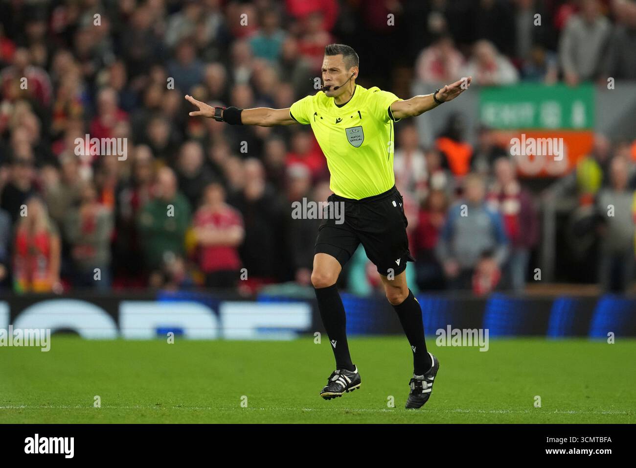 Referee Maurizio Mariani gestures during the Champions League opening ...
