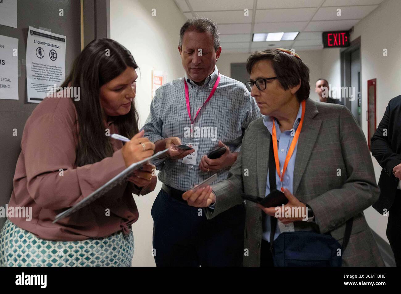 New York City Comptroller Brad Lander signs a form before entering an ...