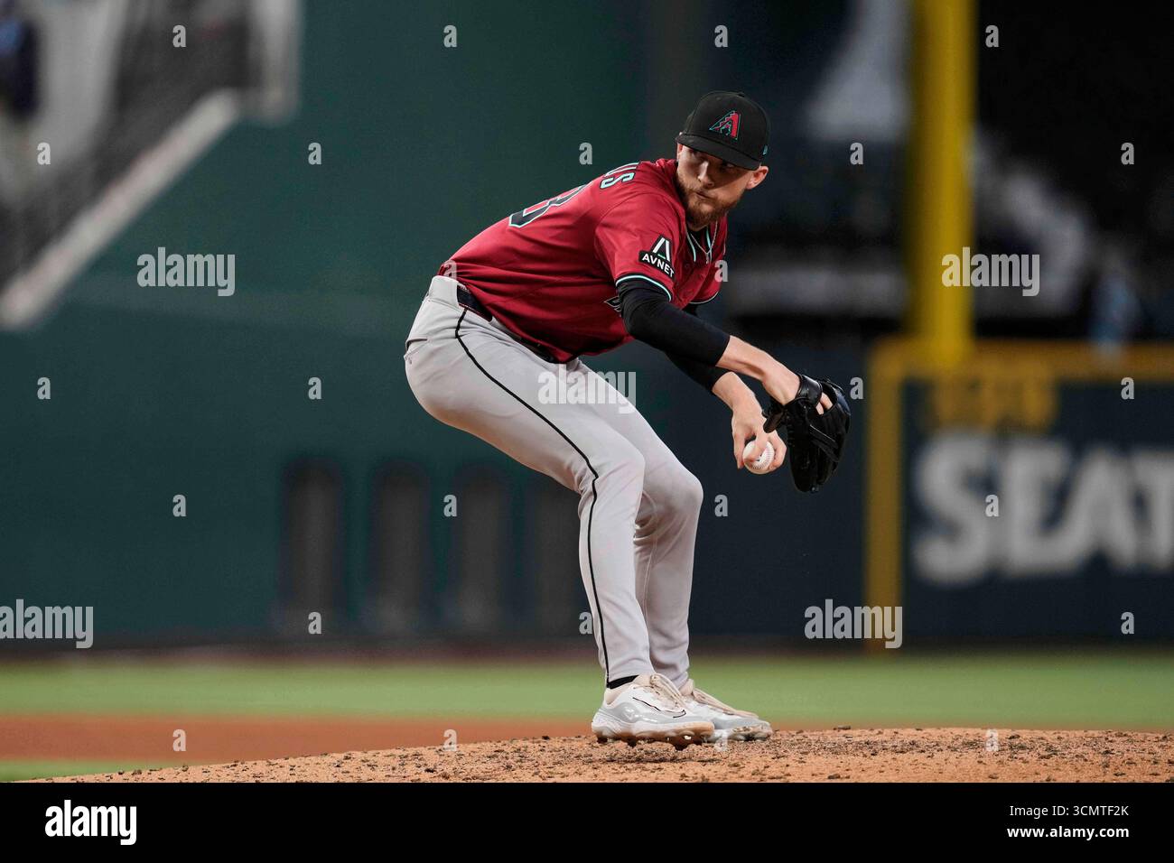 Arizona Diamondbacks relief pitcher Kyle Backhus works against the ...
