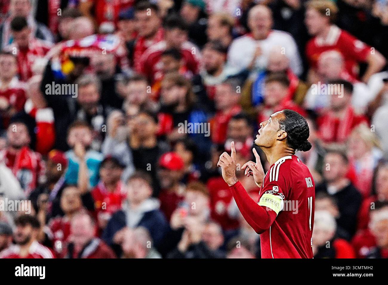 Liverpool's Virgil van Dijk celebrates scoring their side's third goal ...