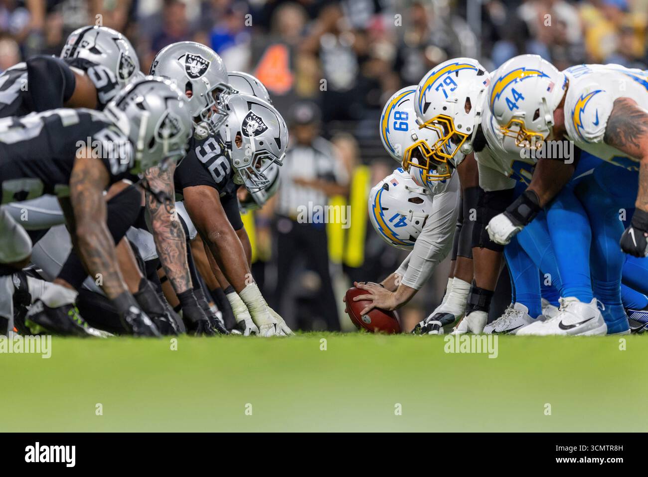 The Los Angeles Chargers line up against the Las Vegas Raiders in an ...