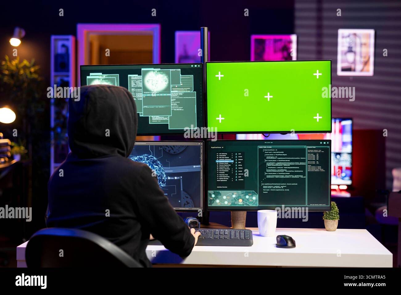 Hacker using green screen PC, coding malware designed to exploit ...