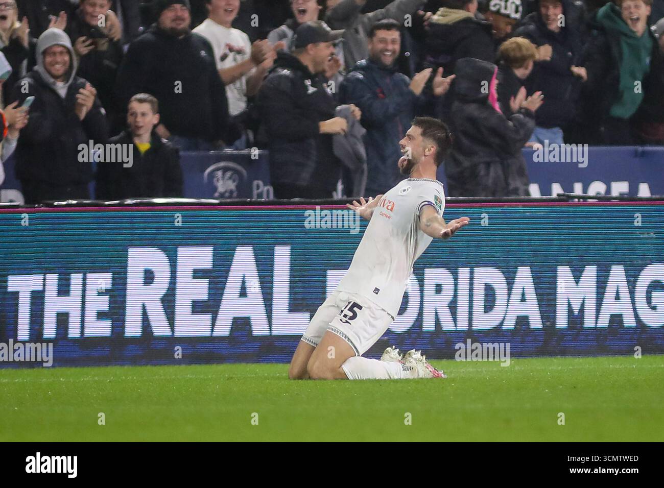 Cameron Burgess of Swansea City celebrates scoring his teams third and ...