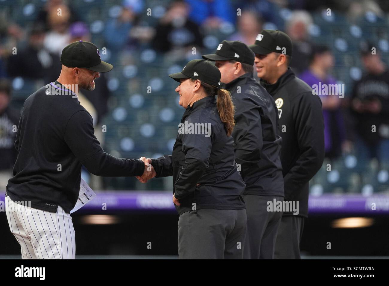Colorado Rockies interim manager Warren Schaeffer (34) greets first ...