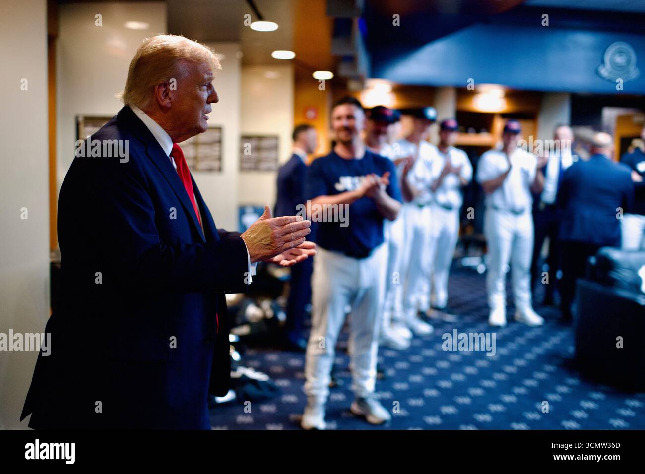 President Donald Trump greets players and coaches with the New York ...